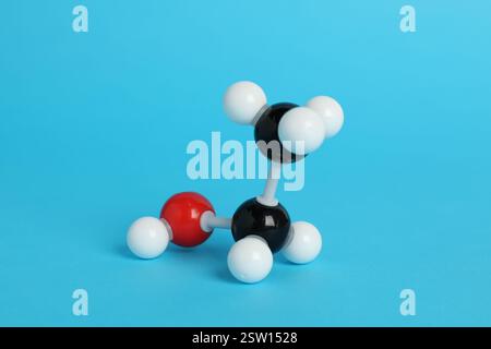 Molecule of ethanol on light blue background. Chemical model Stock ...