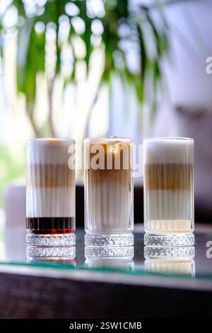 Three layered iced coffee drinks in elegant glasses Stock Photo - Alamy