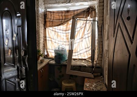 ODESA, UKRAINE - FEBRUARY 20, 2025 - Municipal workers repair a window ...