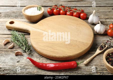 Different healthy products and cutting board on wooden background Stock ...