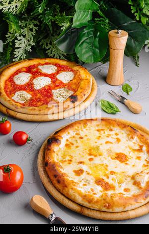 Gourmet margherita and cheese pizzas on rustic table Stock Photo - Alamy