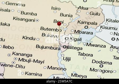 Close up to a Bujumbura city with a red pin needle into Burundi country ...