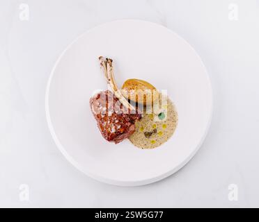 Gourmet lamb chop with roasted potatoes Stock Photo - Alamy