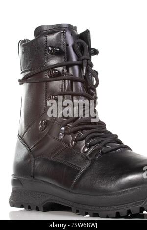 Detailed view of sturdy black military boots. Features included rugged ...