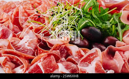 Assorted deli meats plate with garnish Stock Photo - Alamy