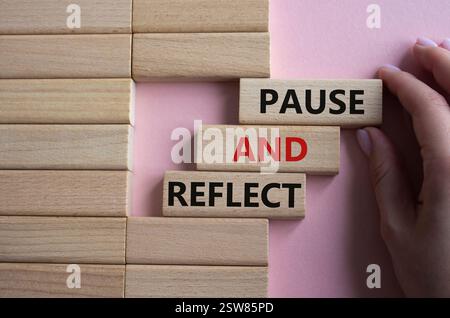 Pause and Reflect symbol. Concept words Pause and Reflect on wooden ...