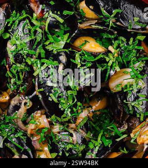 Steamed tasty mussels with green sauce at plate, nobody Stock Photo - Alamy