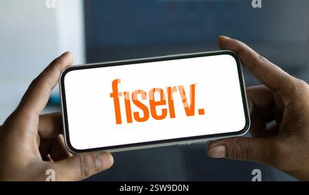 Dhaka, Bangladesh- 31 Oct 2024: Fiserv logo is displayed on smartphone ...