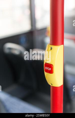 Passenger signals to stop bus with red button Stock Photo - Alamy
