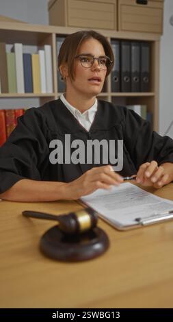 Young hispanic woman wearing judge uniform with a big smile on face ...