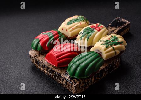 Sweet madeleine sponge cookies covered with colored chocolate Stock ...