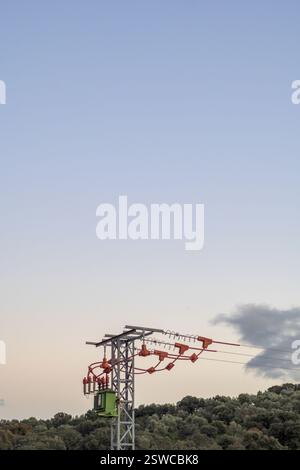 Small electric tower in hydroelectric power station with light ...