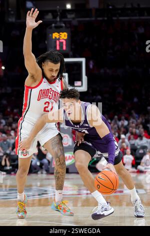 Northwestern guard Ty Berry (3) drives past Maryland center Derik Queen ...