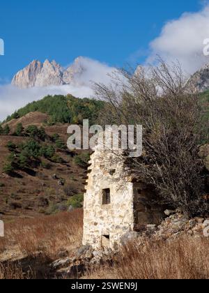 Ancient tower of the Medieval Complex Egikal against mountains and ...