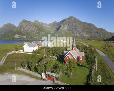Aerial view of Flakstad church. In the background the peaks of the ...
