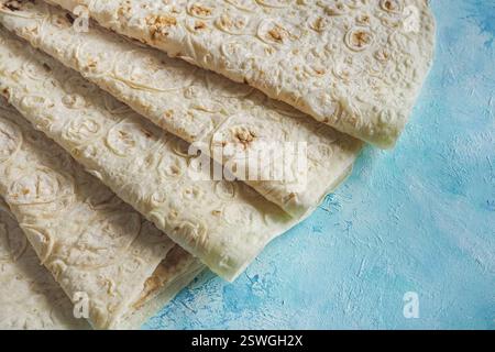 Traditional armenian flat bread - lavash on dark wooden table with ...