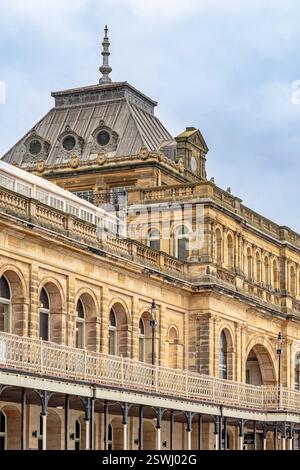 A building of Victorian architecture showing mostly the upper floors ...