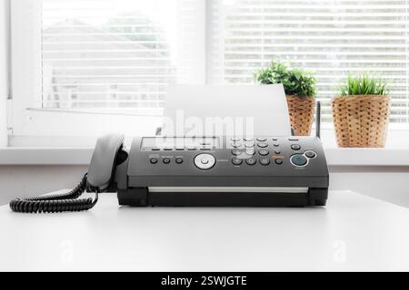 Black fax machine tool close up, business concept Stock Photo - Alamy
