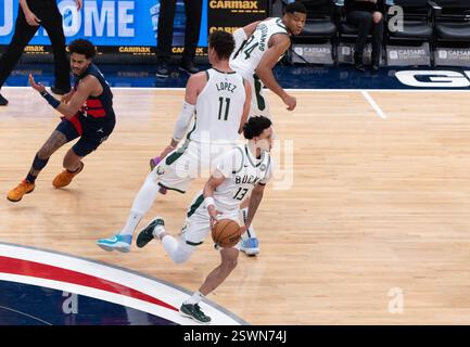 Milwaukee Bucks guard Ryan Rollins attempts a 3-point basket during the ...