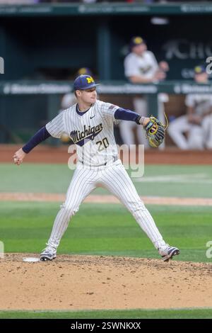 February 21, 2025: Wolverine pitcher Dylan Vigue (27) prepares to ...