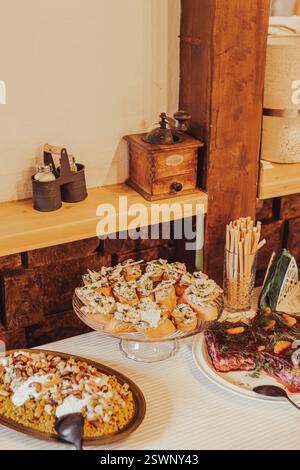 Rustic buffet display featuring various delicious appetizers and food ...