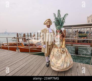 Venice, Italy. 22nd Feb, 2025. Masked revellers take part in the Venice ...