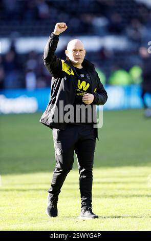 Millwall manager Alex Neil applauds the traveling fans after his sides ...