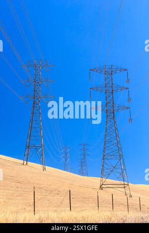 The three power lines at dusk Stock Photo - Alamy