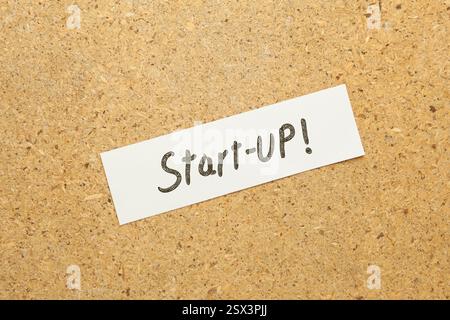 Notebook, sheet of paper with word "Homework" and stationery on grey ...