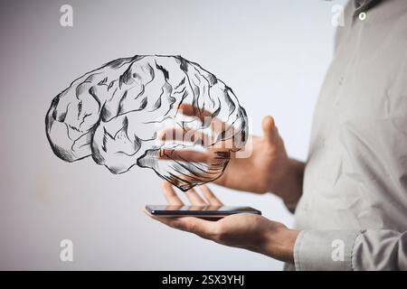 hand holding smartphone with brain in screen Stock Photo - Alamy