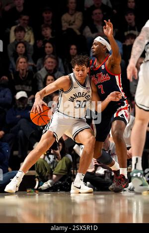 Vanderbilt guard Chris Manon (30) is fouled by Texas A&M forward ...