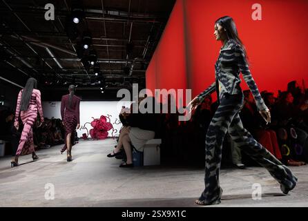 London, UK. Sunday February 23, 2025. A model on the catwalk at the ...