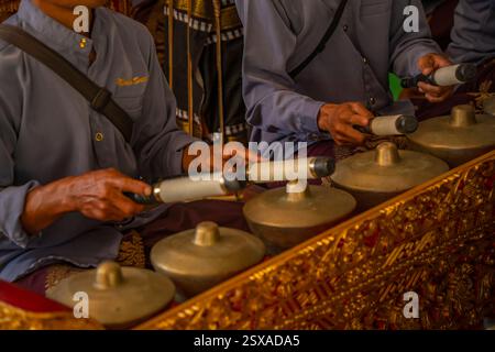 Locals playing Gamelan Saron Gangsa, traditional musical instruments ...