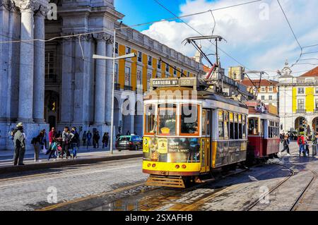 "Timeless Transit: Iconic Buses Navigate Lisbon's Heart, Portugal Stock ...