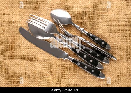 Cutlery on jute cloth, macro, top view Stock Photo - Alamy