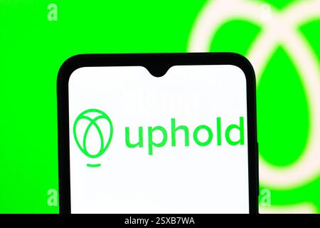 In this photo illustration, the Uphold logo seen displayed on a ...