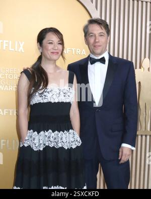 Sean Baker, left, and Samantha Quan arrive at the Vanity Fair Oscar ...
