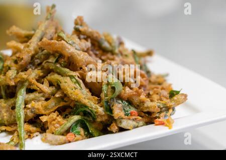 Deep fried french beans with salted duck egg yolk Stock Photo - Alamy