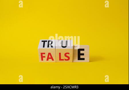True vs False symbol. Wooden cubes with words False and True. Beautiful ...