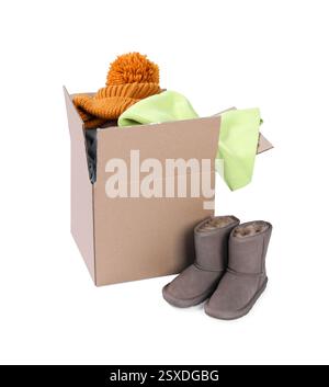 Different used clothes and boots in box isolated on white Stock Photo ...