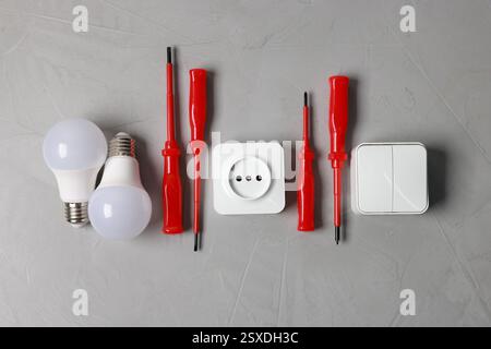 Different electrical tools on grey table, above view Stock Photo - Alamy