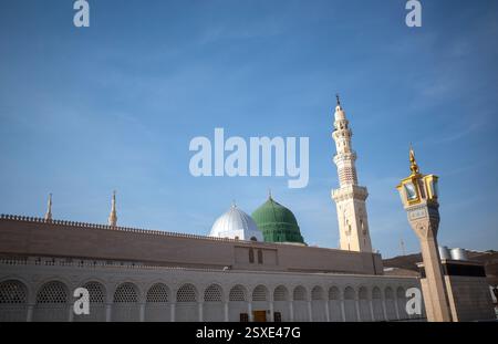 A green dome and minarets in Prophet Mosque in Madinah, also known as ...