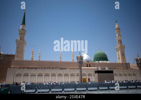 A green dome and minarets in Prophet Mosque in Madinah, also known as ...
