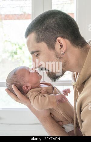 A Tender Moment Shared Between Father and His Baby A Deeply Heartwarming Connection Stock Photo ...