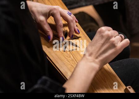 Fingers of a girl playing kankles, Lithuanian plucked string instrument ...