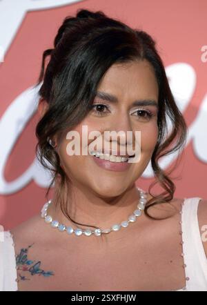 MIAMI, FLORIDA - FEBRUARY 22: Valentina Bueno (C) attends Karol G's Con ...