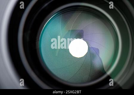 The f-stop or aperture on a lens controls the amount of light allowed ...