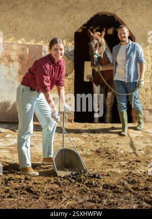 Young Woman Farmer Cleans Rake Dry Grass Stock Photo Alamy