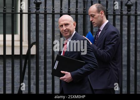 Defence Secretary John Healey (left) is greeted by Defence Minister ...