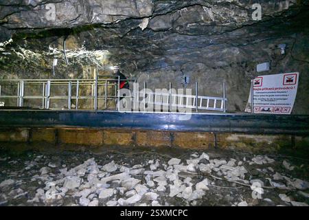 Workers repair electrical installation in tourist route along the ...